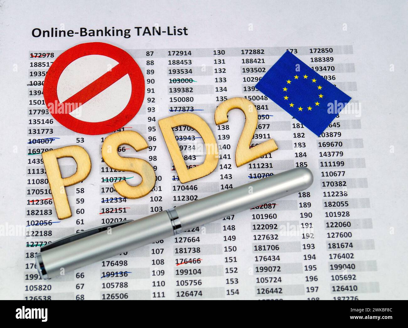 lettering 'PSD2', fountain pen, European flag and prohibition sign with ...
