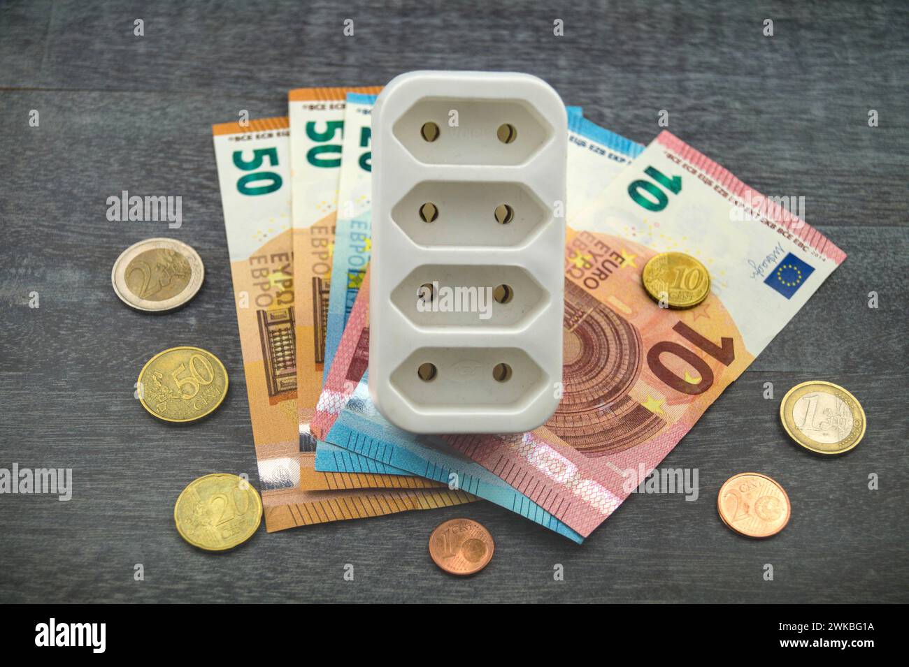 Socket and money, symbolic image of electricity costs Stock Photo - Alamy