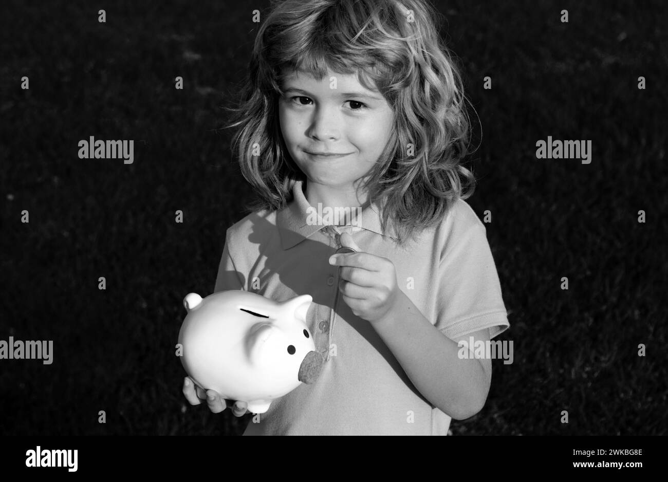 Portrait of cute little boy with piggy bank. Saving money concept. Kids ...