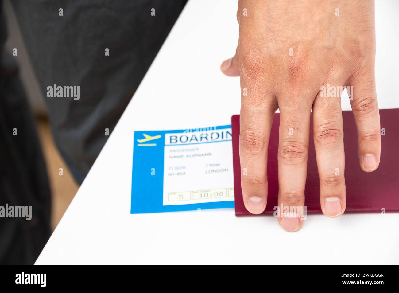 Man holding boarding pass ticket hi-res stock photography and images ...