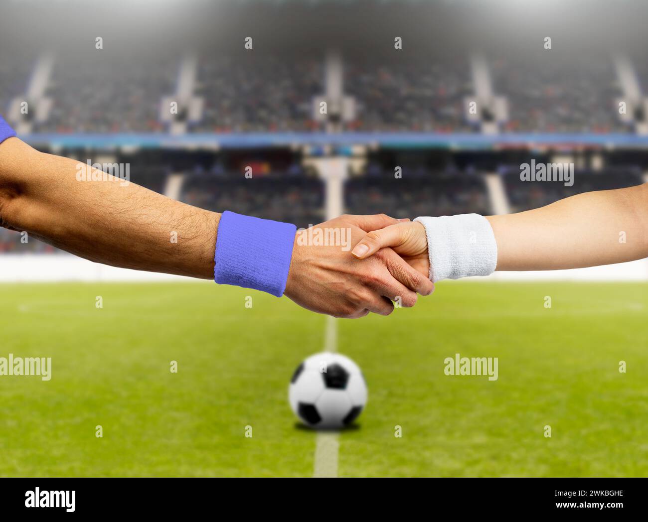 Cropped image of soccer player doing handshake at stadium Stock Photo ...