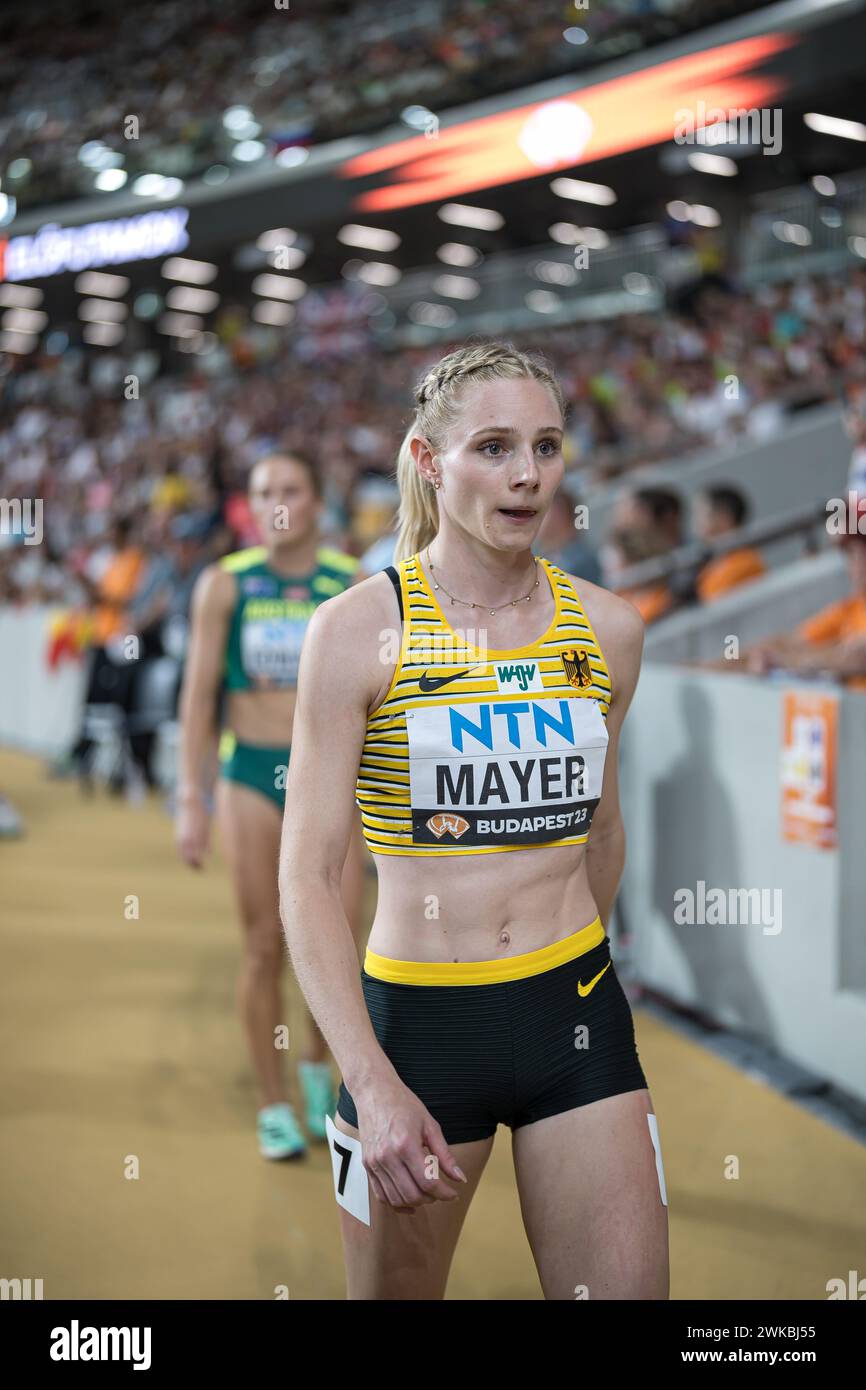 Sina MAYER participating in the triple jump at the World Athletics ...