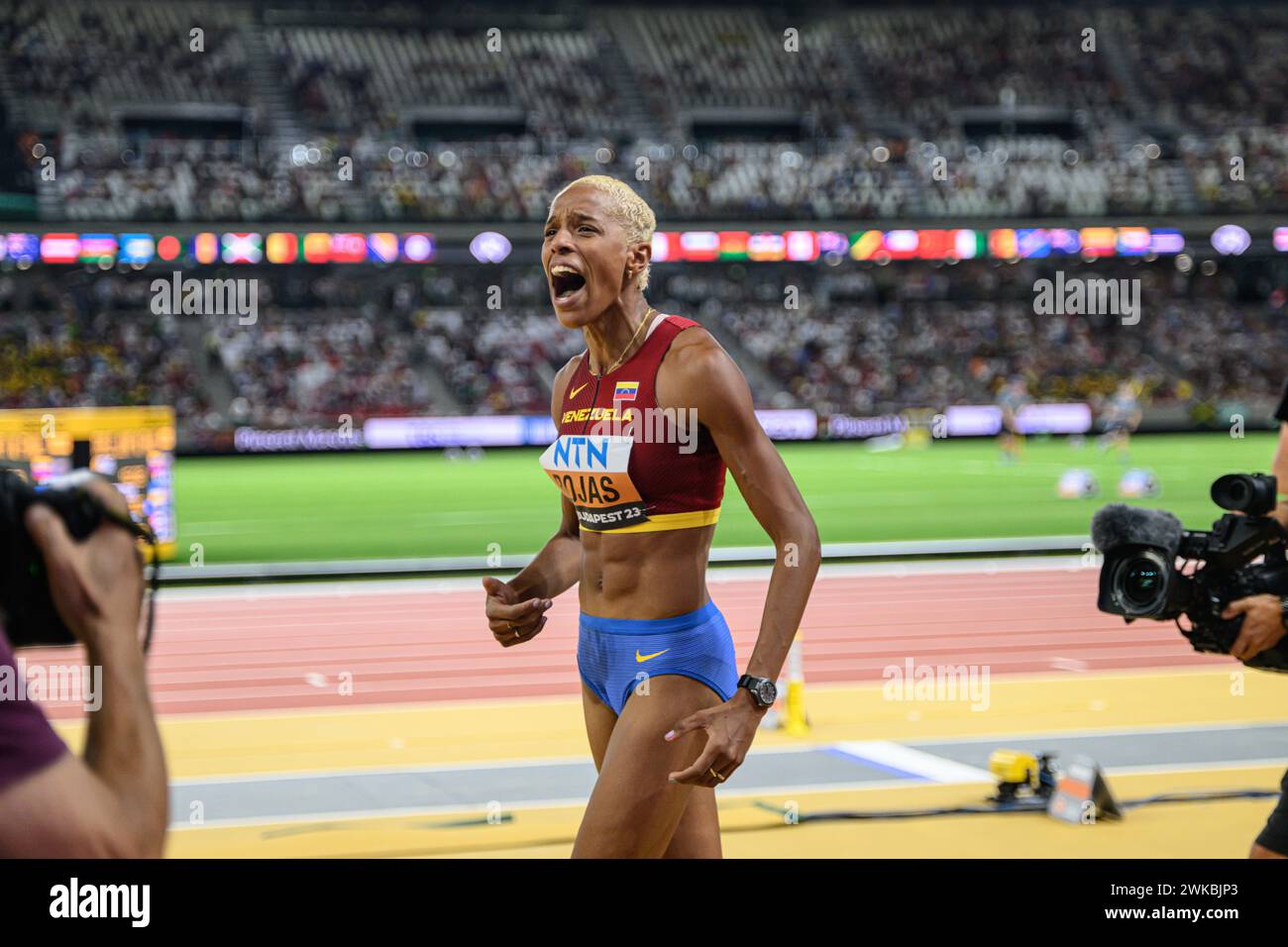 Yulimar ROJAS celebrating his medal with the flag in the Budapest 2023 ...