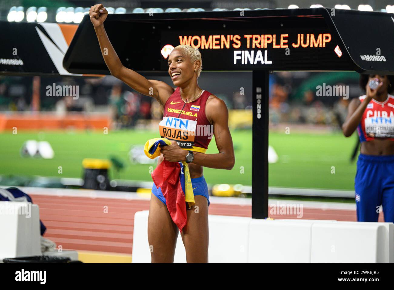 Yulimar ROJAS celebrating his medal with the flag in the Budapest 2023 ...