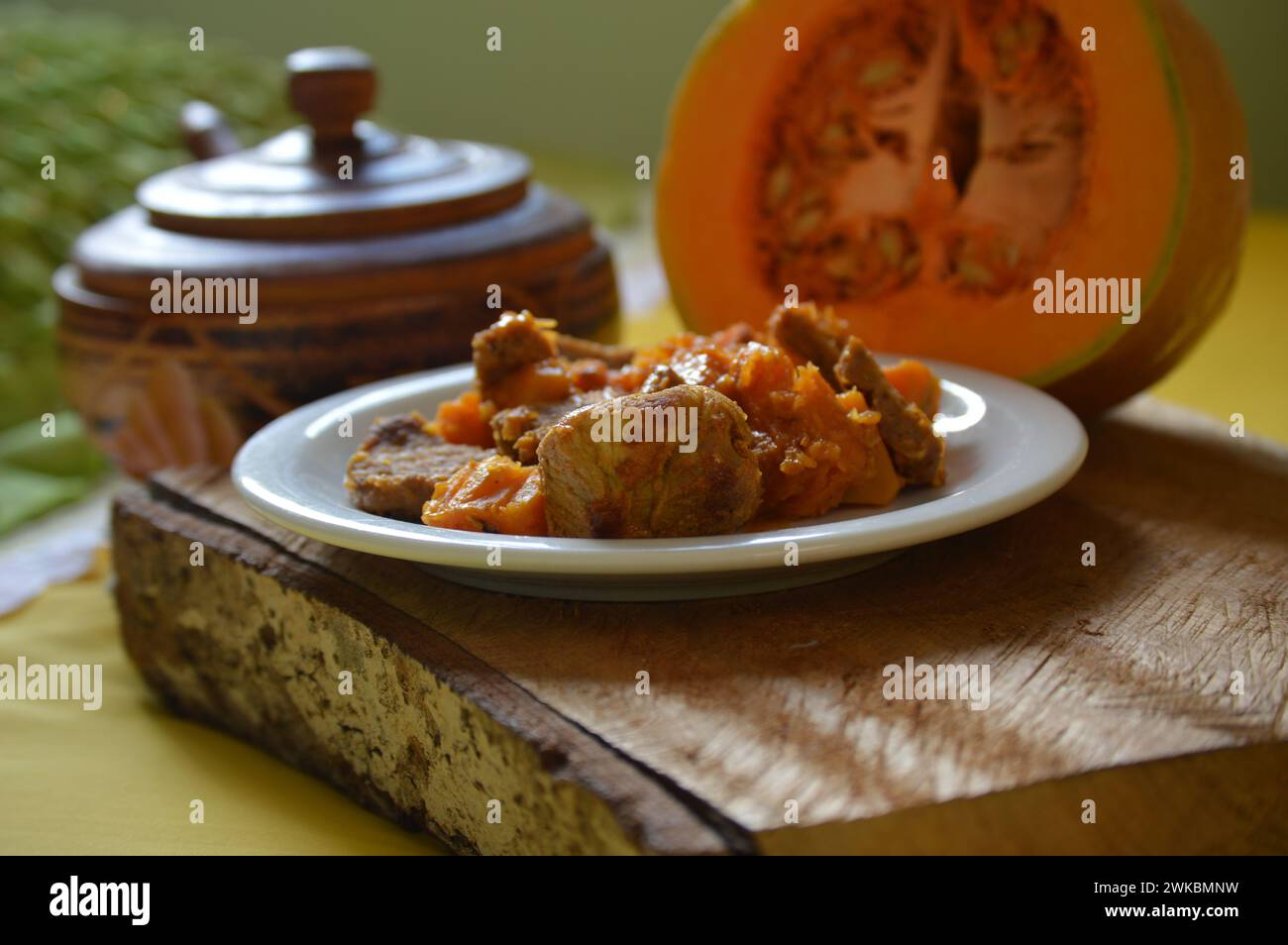 Pumpkin with meat served in a wooden bowl, a delicacy of Brazilian ...