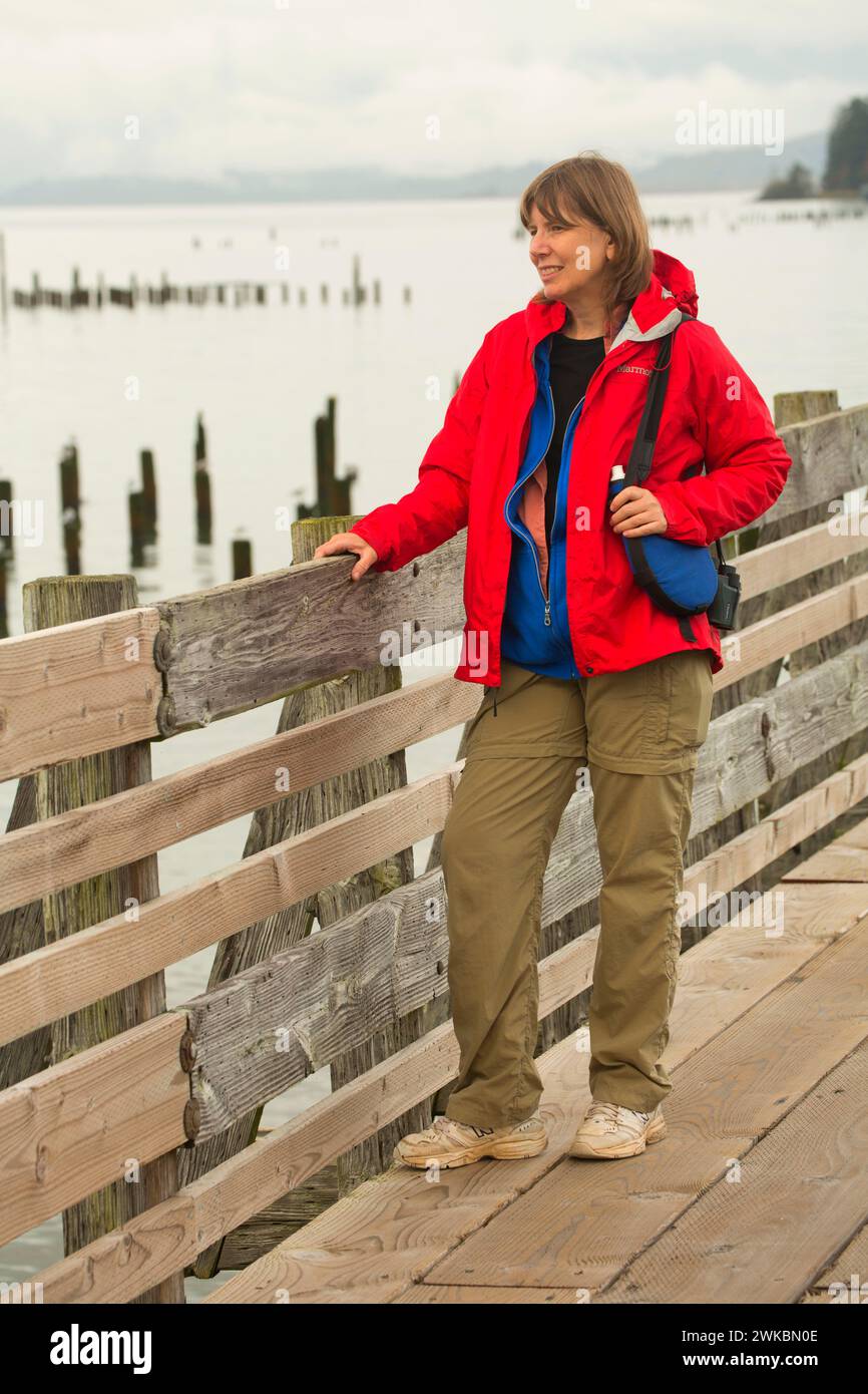 Walker along Columbia River, Astoria Riverwalk, Astoria, Oregon Stock ...