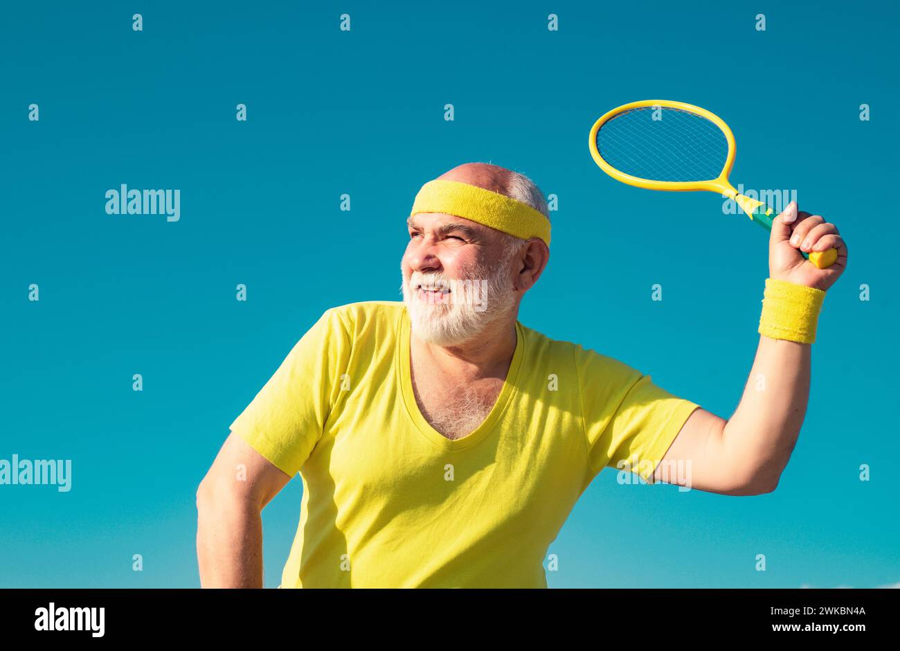 Tennis is fun. Senior man tennis player serving. Age is no excuse to ...