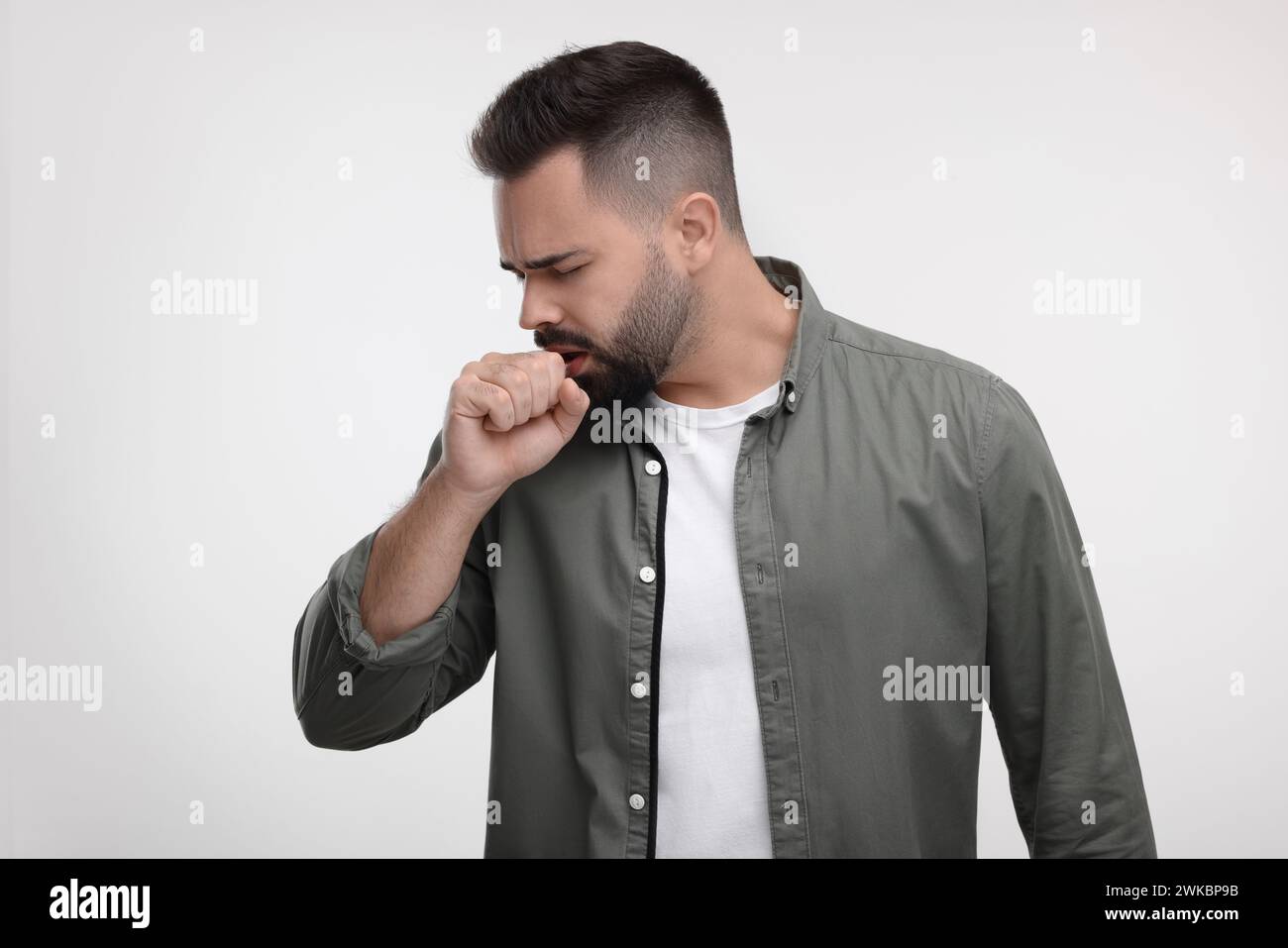 Sick man coughing on white background. Cold symptoms Stock Photo - Alamy