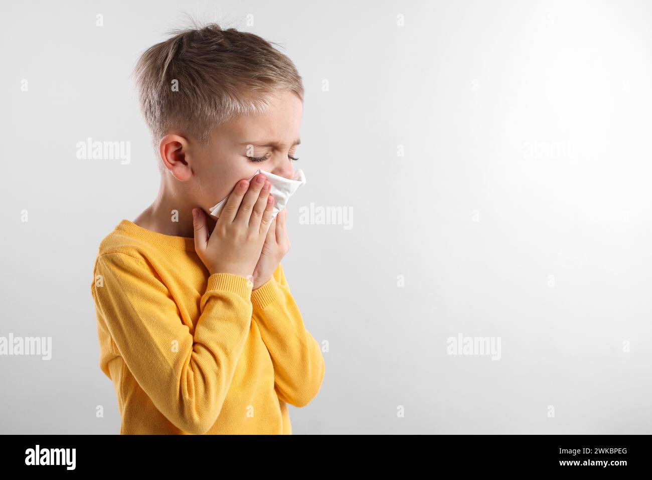 Boy coughing tissue hi-res stock photography and images - Alamy