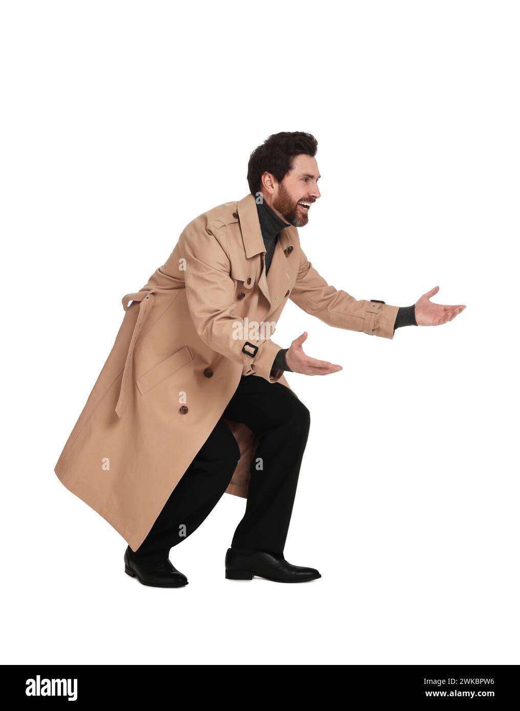 Handsome man greeting someone on white background Stock Photo - Alamy