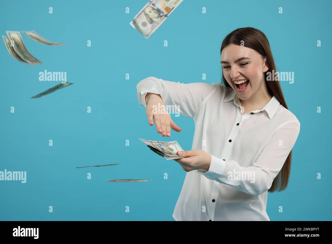 Young female lottery winner throwing hi-res stock photography and ...