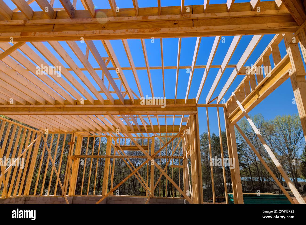 An timber wood stick frame framing beams in during built new house ...