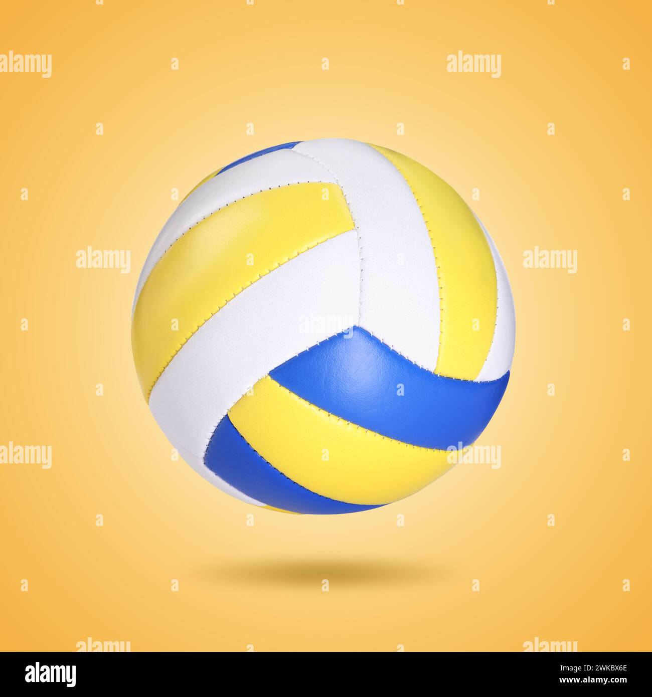One volleyball ball in air on orange background Stock Photo - Alamy