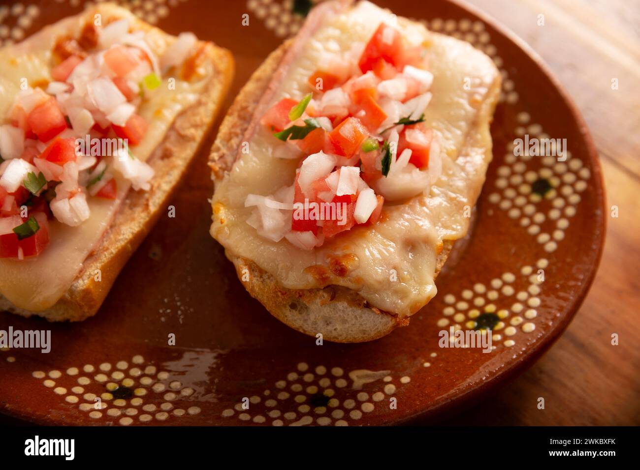 Molletes. Mexican recipe based on bolillo bread split lengthwise ...