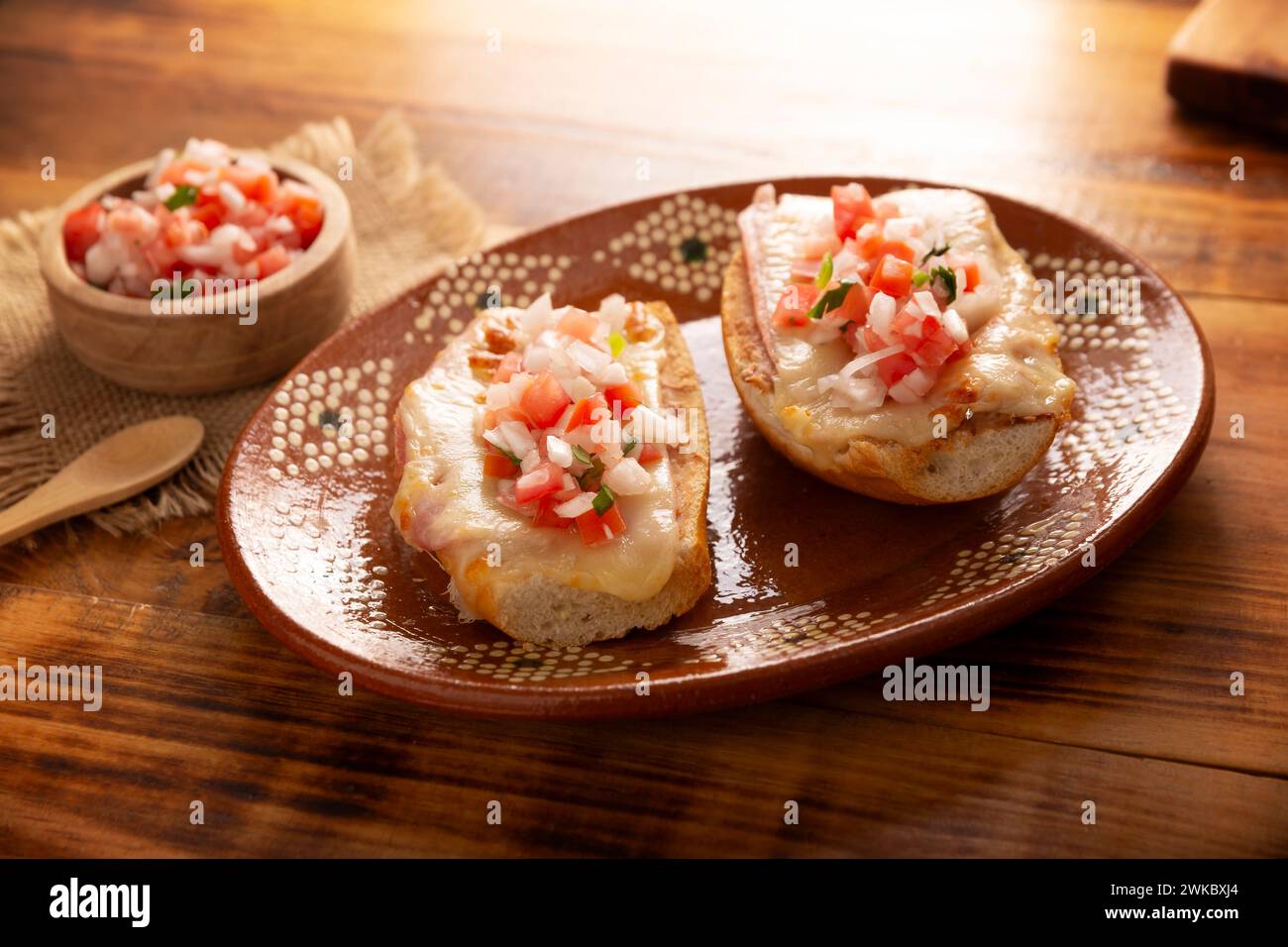 Molletes. Mexican recipe based on bolillo bread split lengthwise ...