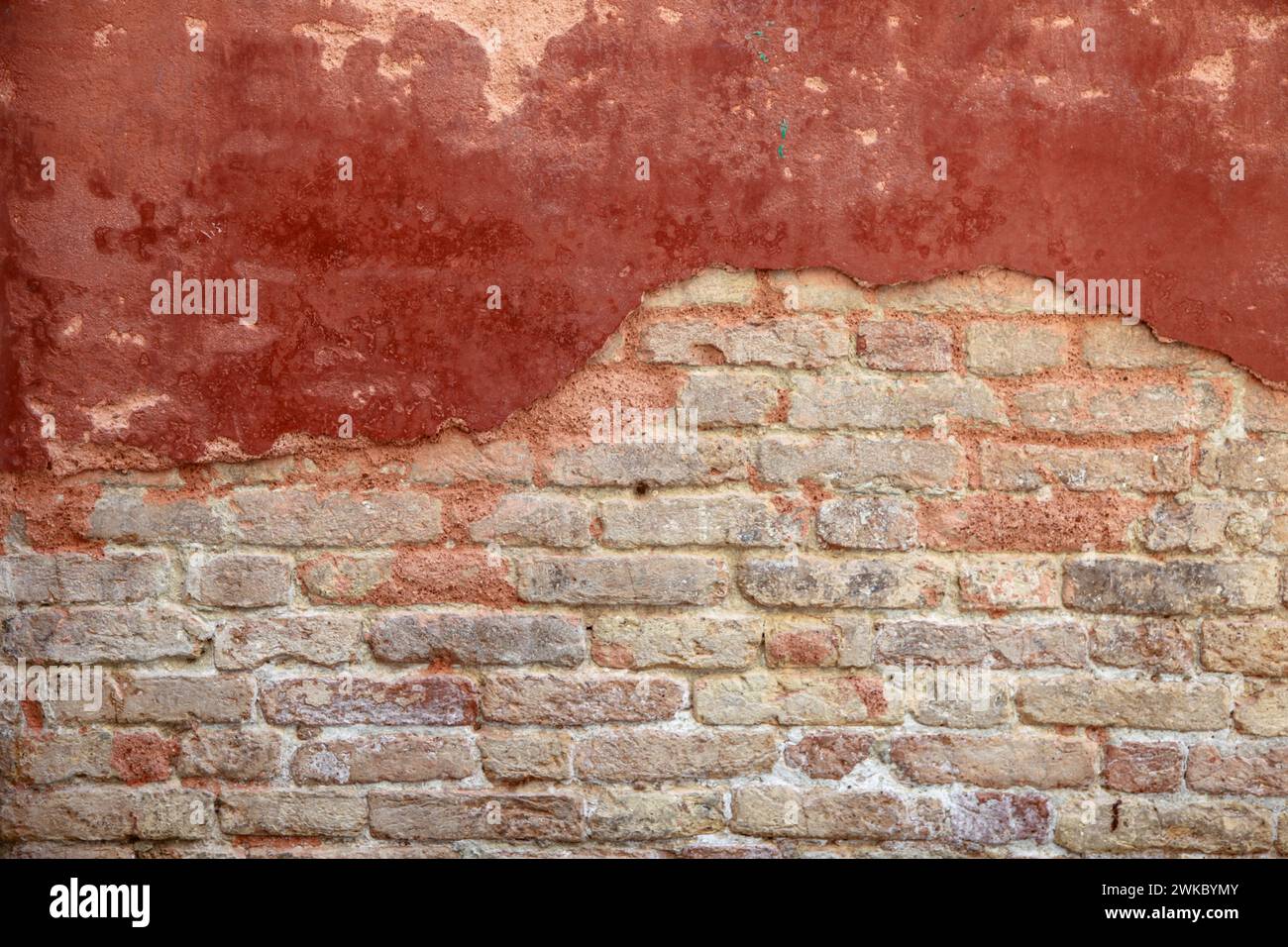 Old red brick wall of an ancient building in Venice, Italy Stock Photo ...