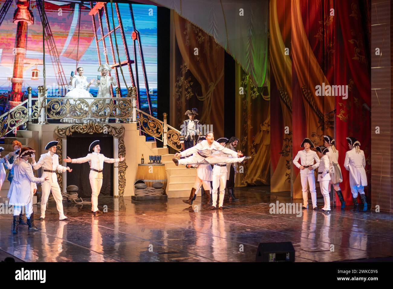 Actresses and actors acting and singing in the musical Stock Photo - Alamy