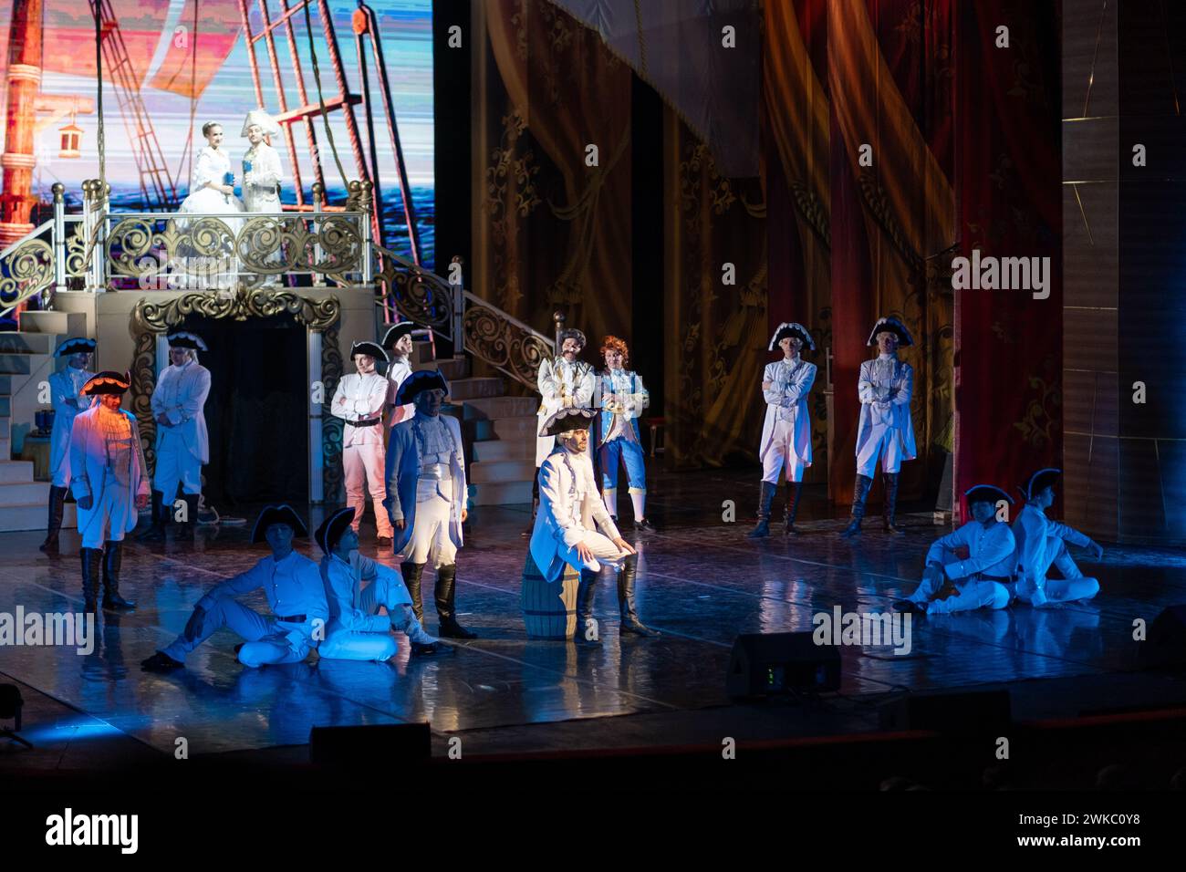 Actresses and actors acting and singing in the musical Stock Photo - Alamy