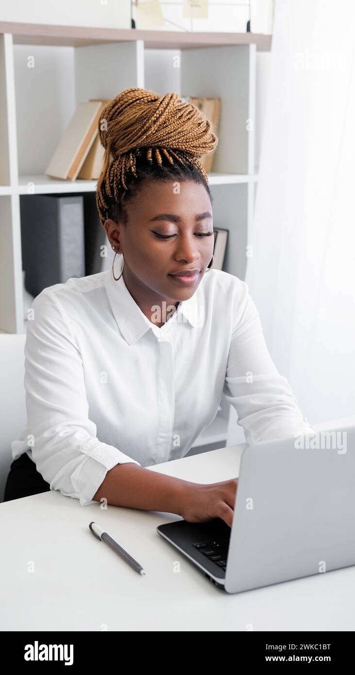 Laptop work distance job concentrated woman typing Stock Photo - Alamy