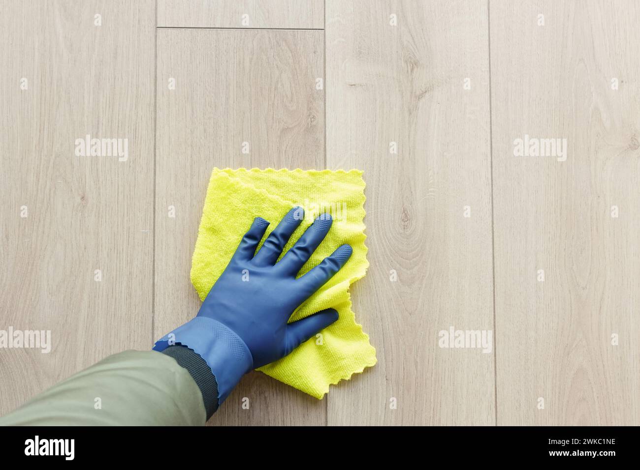 A man's hand washing the floor with a cloth Stock Photo - Alamy