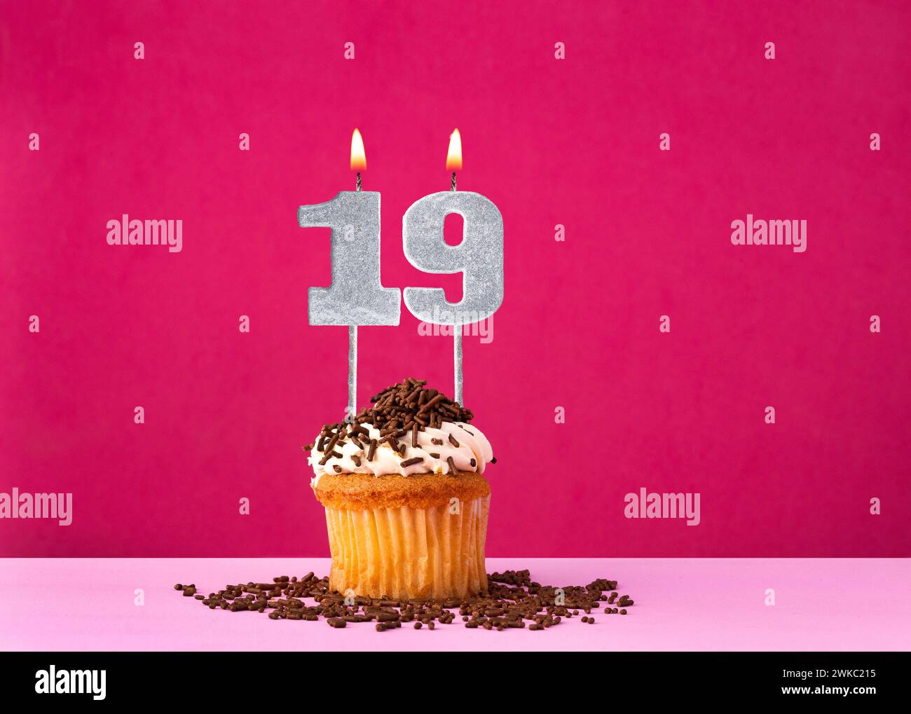 Birthday cupcake with candle number 19 - Birthday card on pink ...