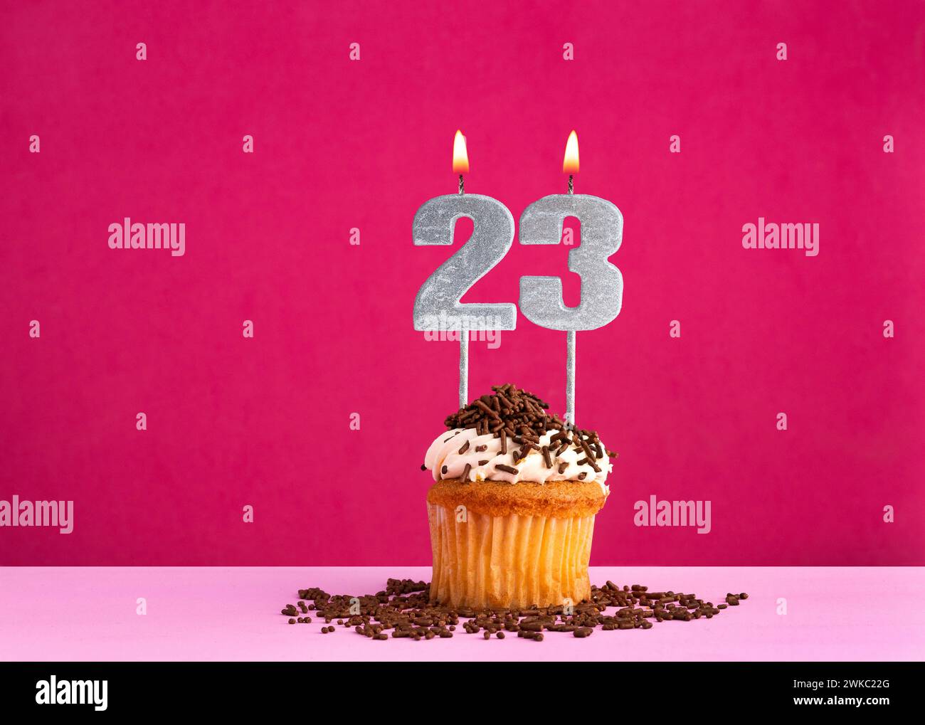 Birthday cupcake with candle number 23 - Birthday card on pink ...