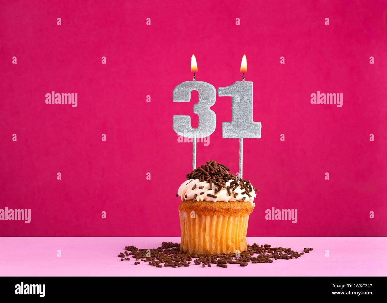 Birthday cupcake with candle number 31 - Birthday card on pink ...