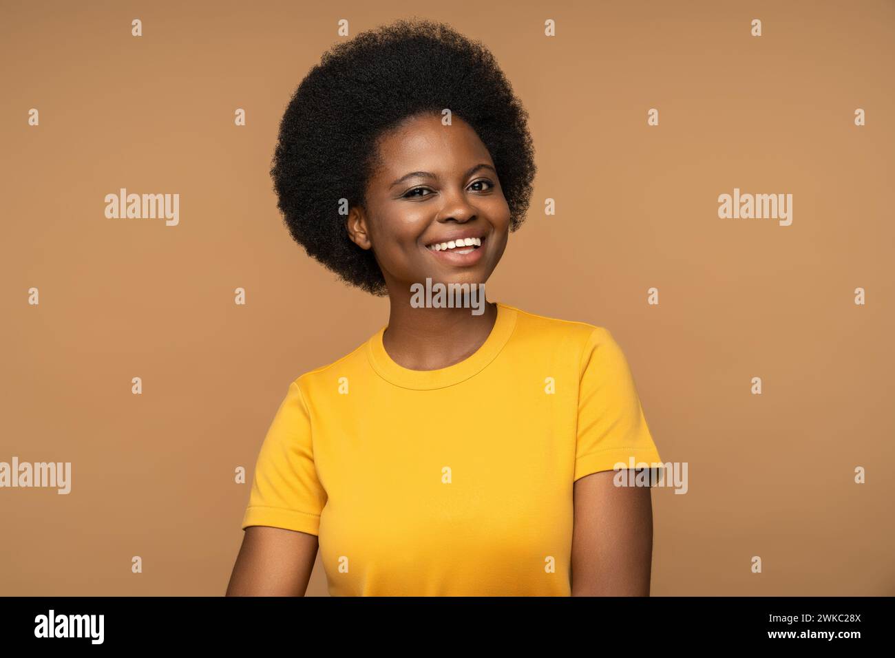 Joyful candid smiling black female, looking at camera, isolated in ...