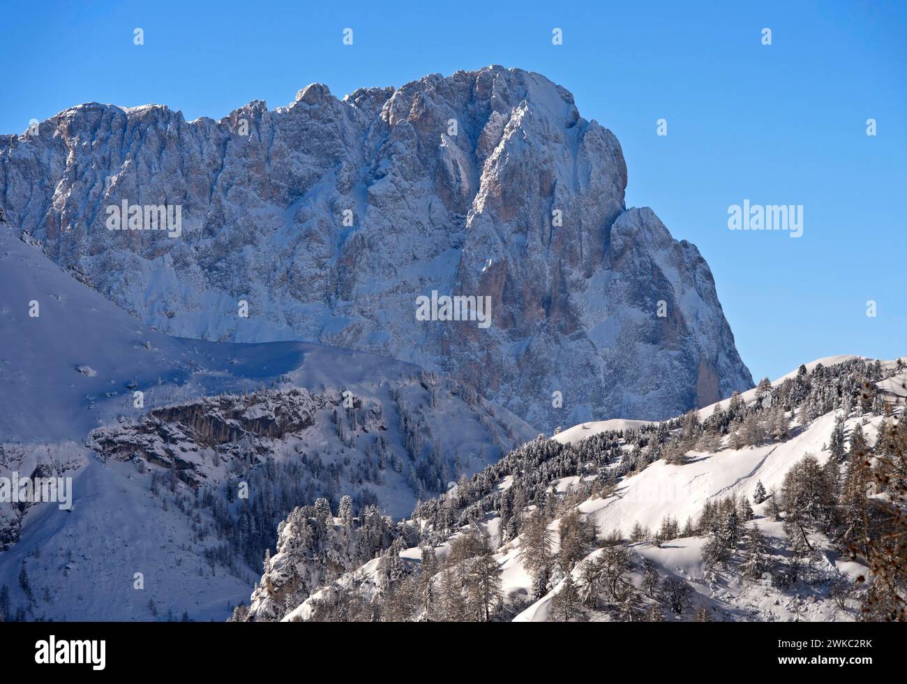 Rugged rock face of the Sassolungo massif, Sassolungo, in winter ...