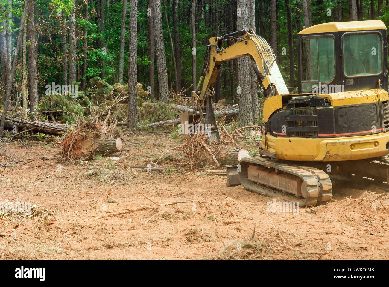 To prepare land for residential construction, excavators tractors are ...