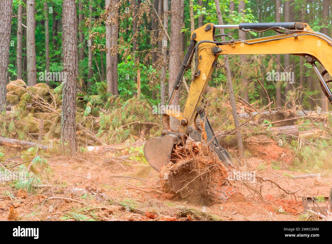 To prepare land for construction of residential complex, excavators ...