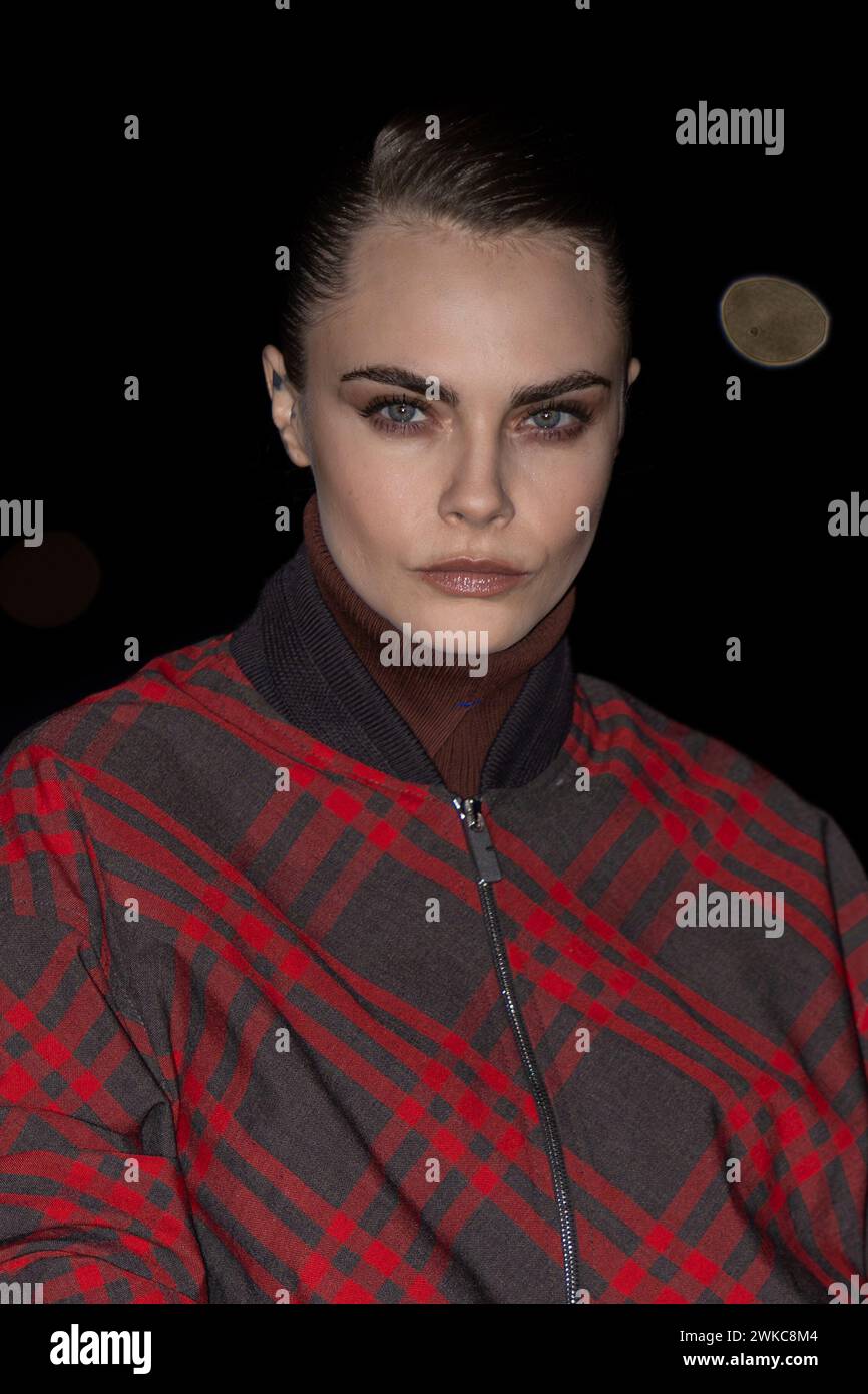 Cara Delevingne poses for photographers upon arrival at the Burberry ...