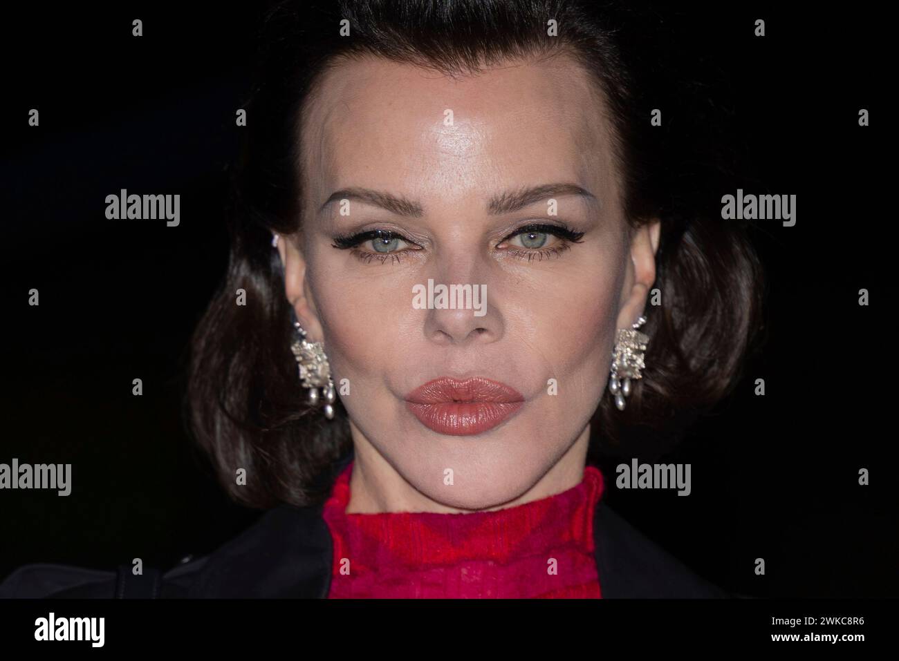 Debi Mazar poses for photographers upon arrival at the Burberry Winter ...