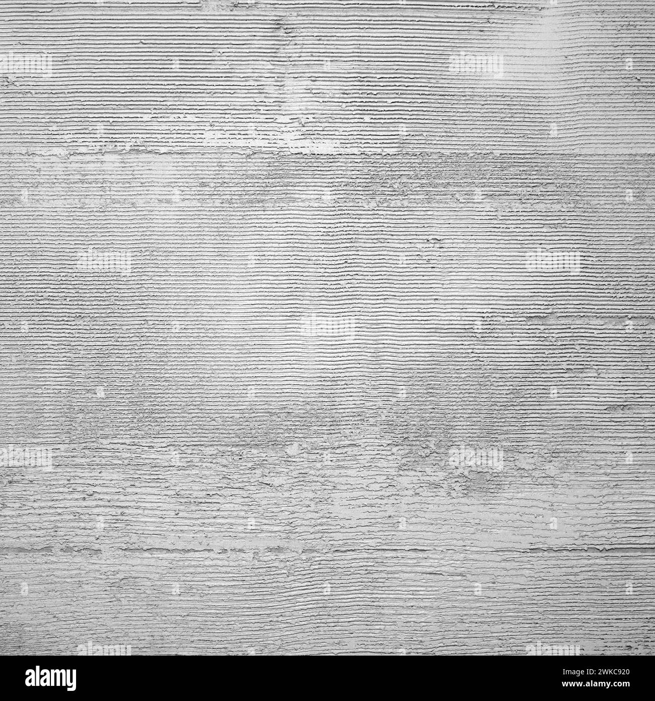 Gray decorative plaster on the wall with pressed horizontal stripes ...