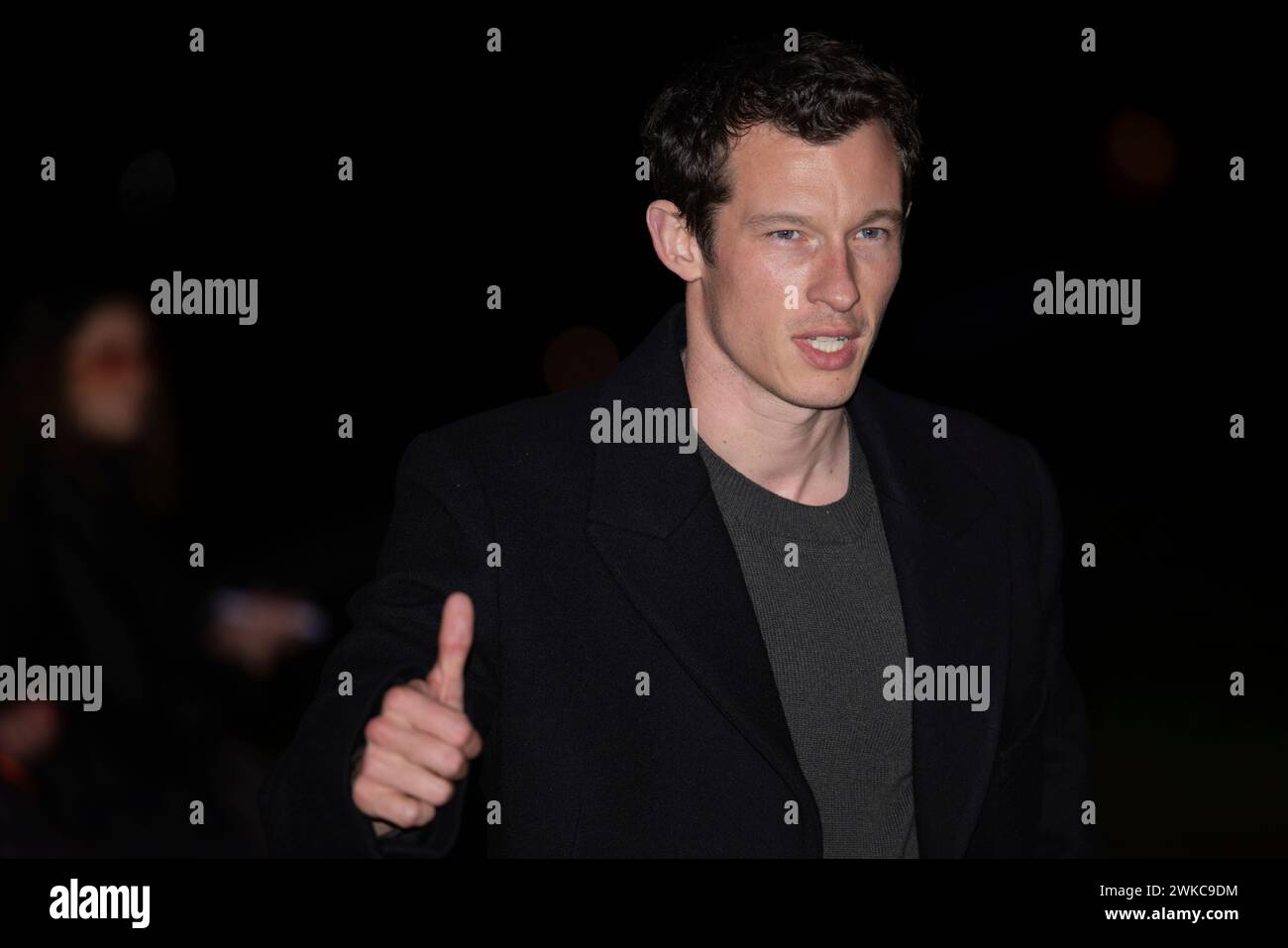 Callum Turner poses for photographers upon arrival at the Burberry ...