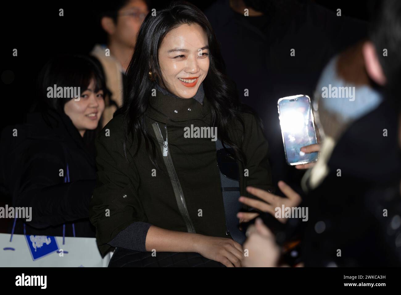 Tang Wei greets fans following the Burberry Winter 2024 fashion show on Monday, Feb. 19, 2024 in ...