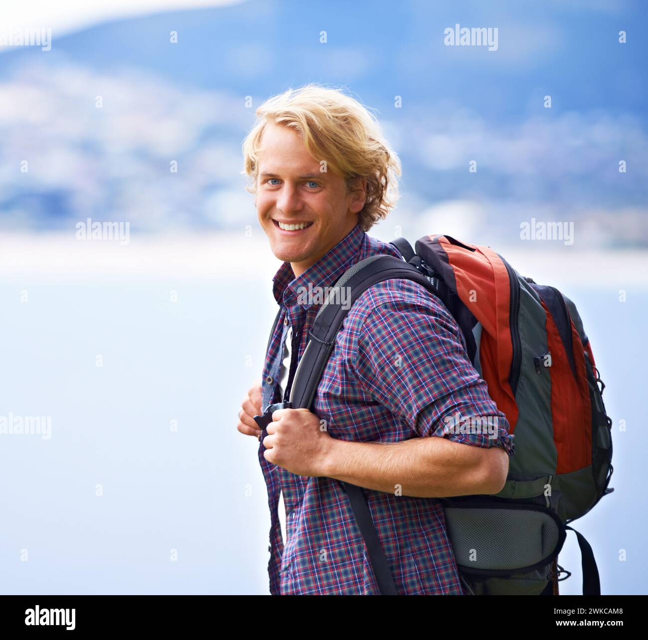 Man, trekking and portrait on mountains for travel, adventure and ...