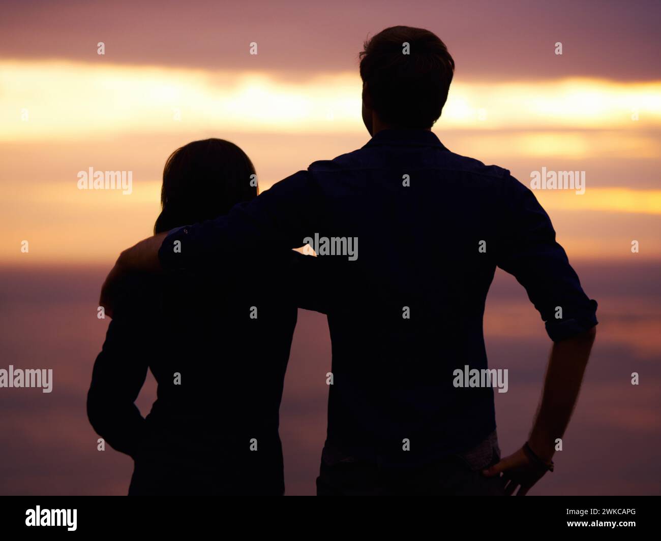 Back, sunset and couple hug with silhouette, view outdoor with nature ...