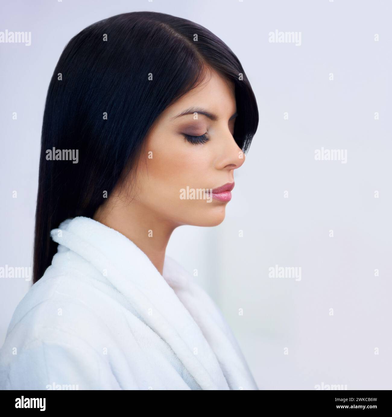 Woman, profile and skincare or makeup in studio, cosmetics and bathrobe ...
