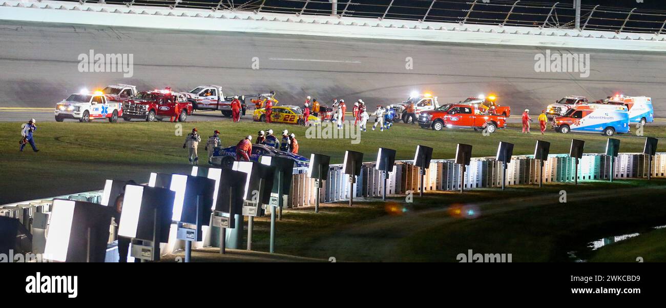 Daytona, United States. 19th Feb, 2024. Crews work to clear wreckage ...