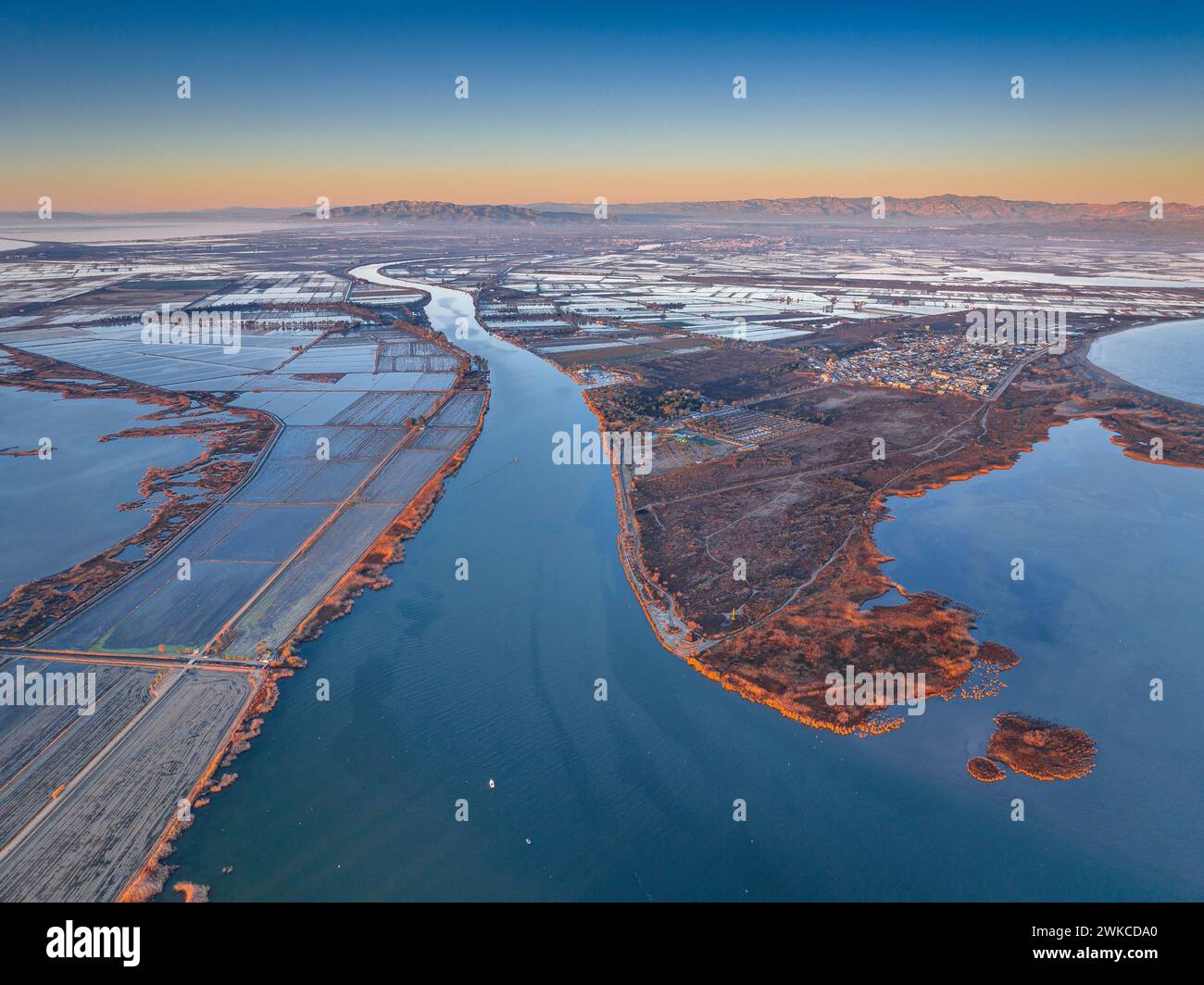 Aerial view of the Ebro river at the mouth in the Ebro Delta on a ...