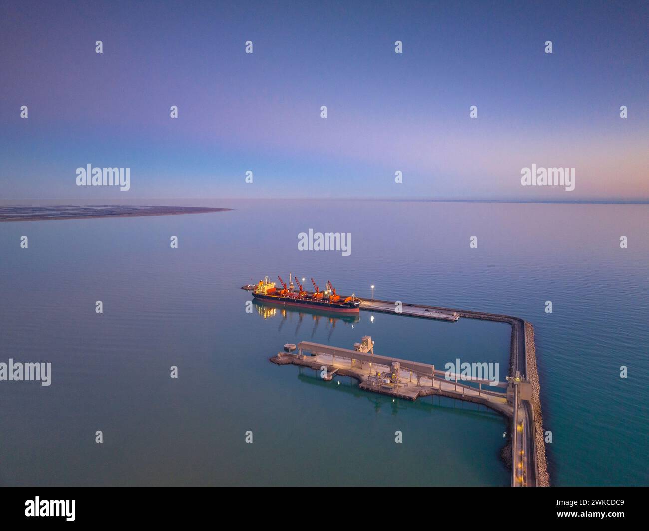 Aerial view of the industrial port of Alcanar on a winter sunset ...