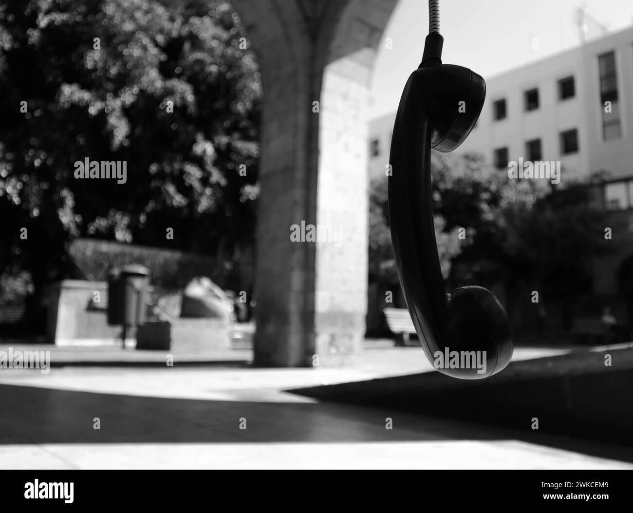 Pay phone hanging by it's wire in a lonely part of downtown Guadalajara ...