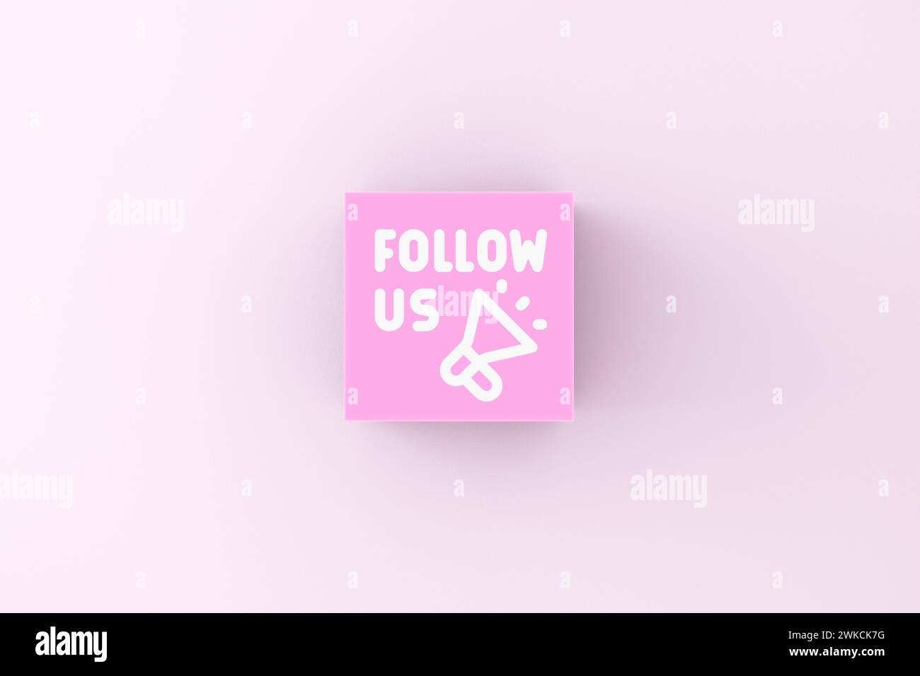 Follow us message on a pink cube block. Social Media Networking ...