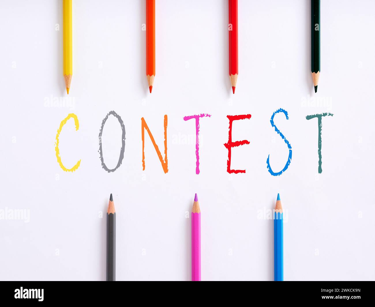 Handwritten word weekend and colorful crayons on white background ...