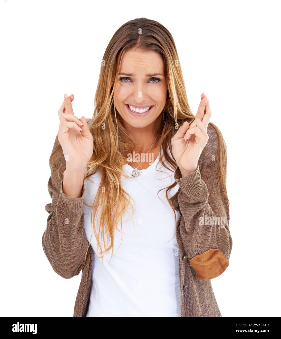 Woman, portrait and crossed fingers for hope in studio, praying and ...