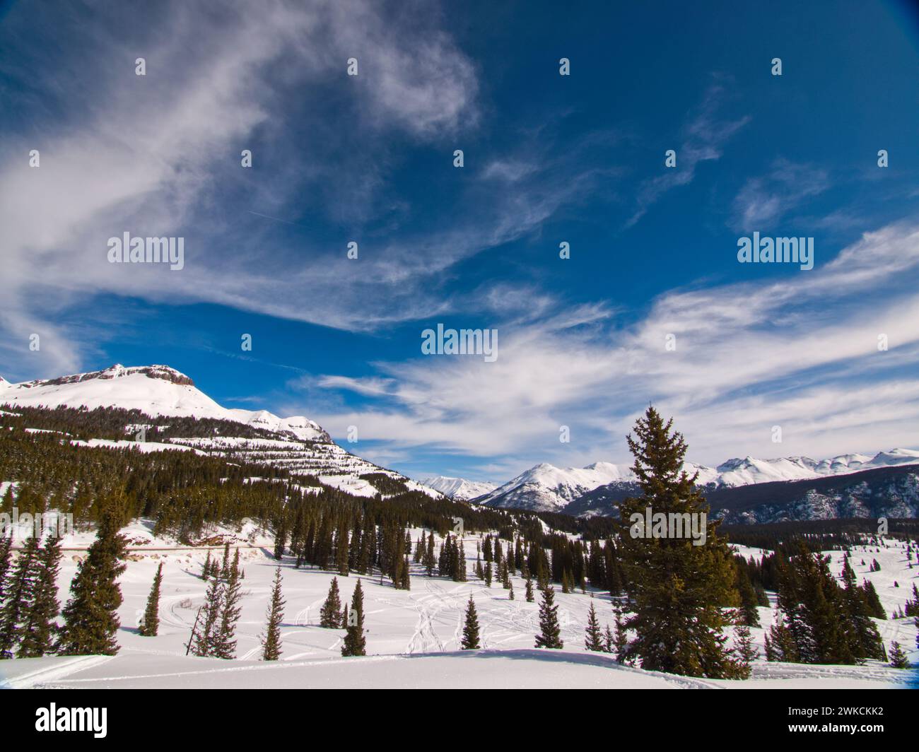 snow capped mountain peaks under blue sky in colorado Stock Photo - Alamy