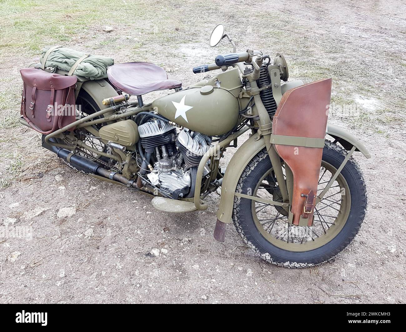 military motorcycle with a leather rifle holster attached to a front ...