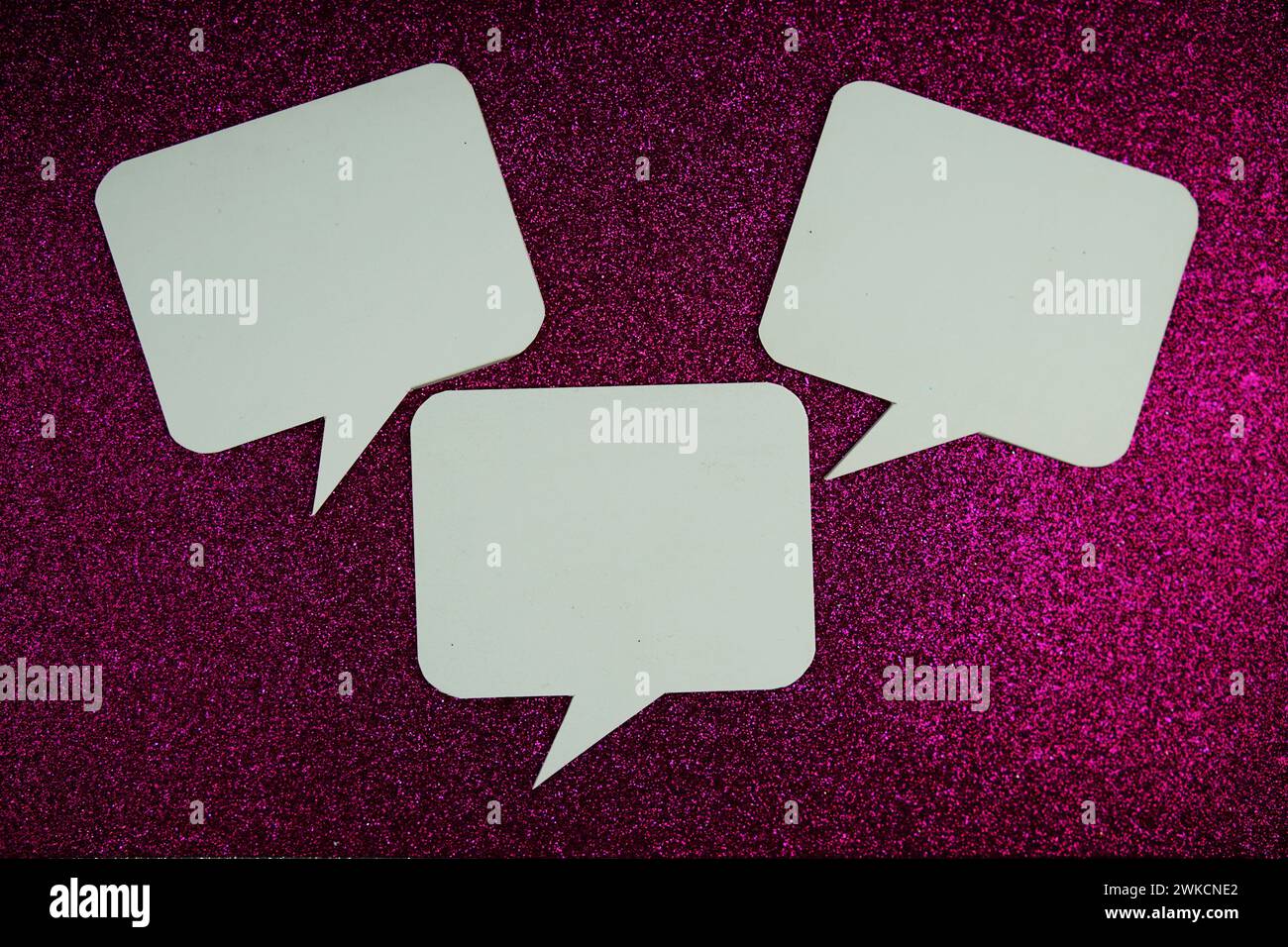 White Speech bubble mockup top view on pink glitter background Stock ...