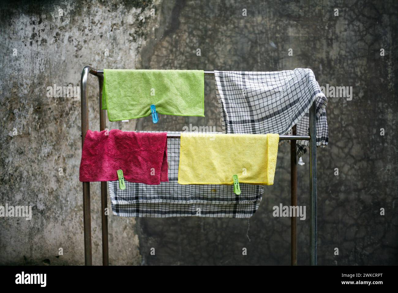 Duster cloth and rags hanging on a towel rack Stock Photo - Alamy